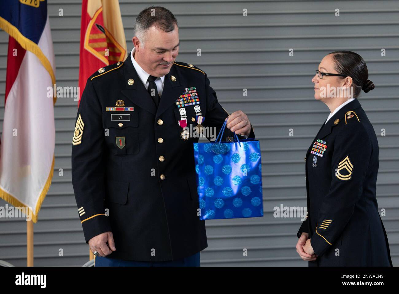 Command Sgt. Maj. Randy Ly, left, completes his last official duty for ...