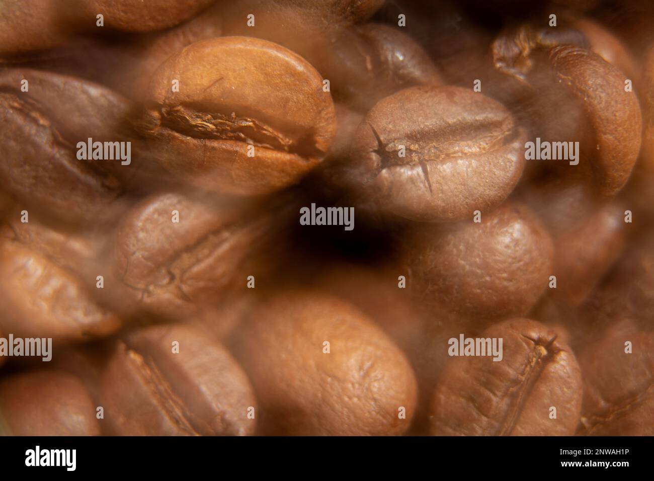 roasted coffee beans with blurred focus on exposure, coffee beans as ...