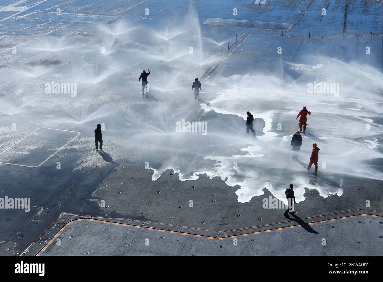 PACIFIC OCEAN (Jan 21, 2023) Sailors perform a countermeasure washdown ...