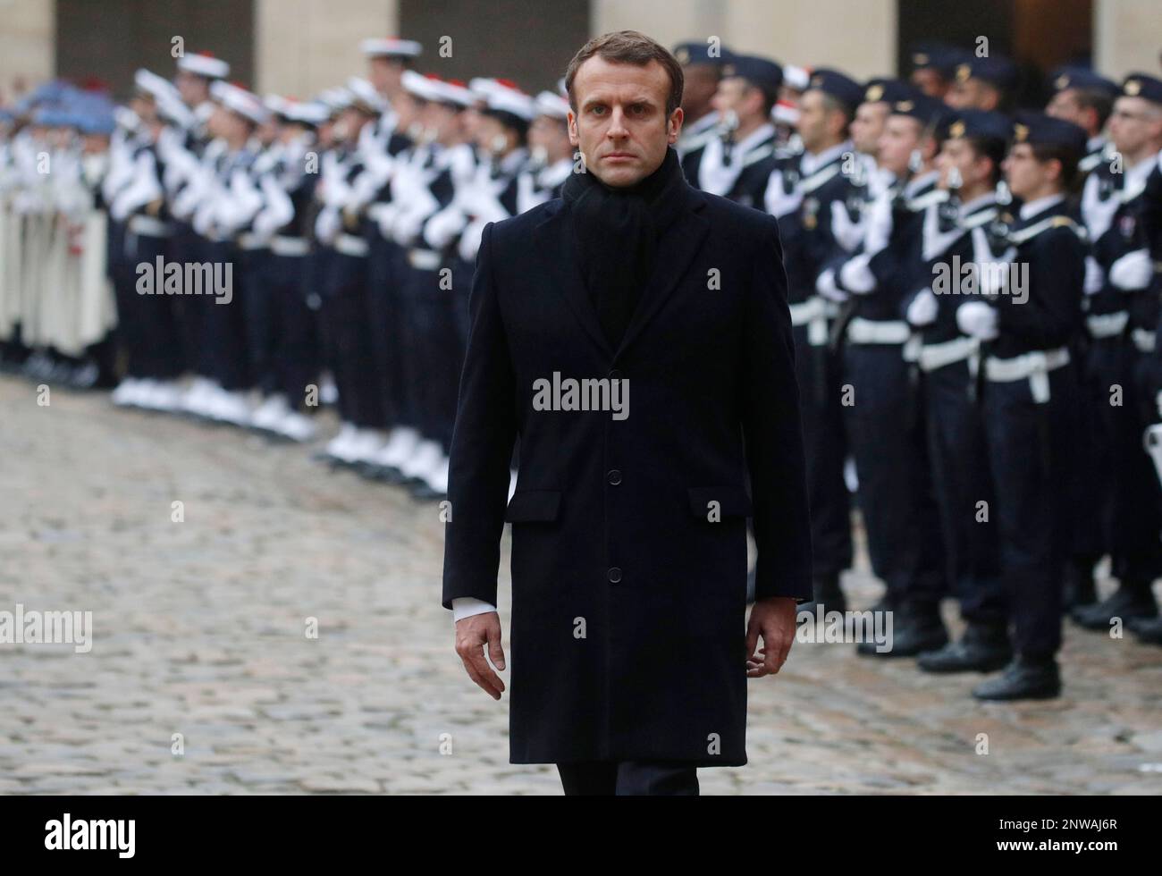 French President Emmanuel Macron inspects the honor guards during a ...