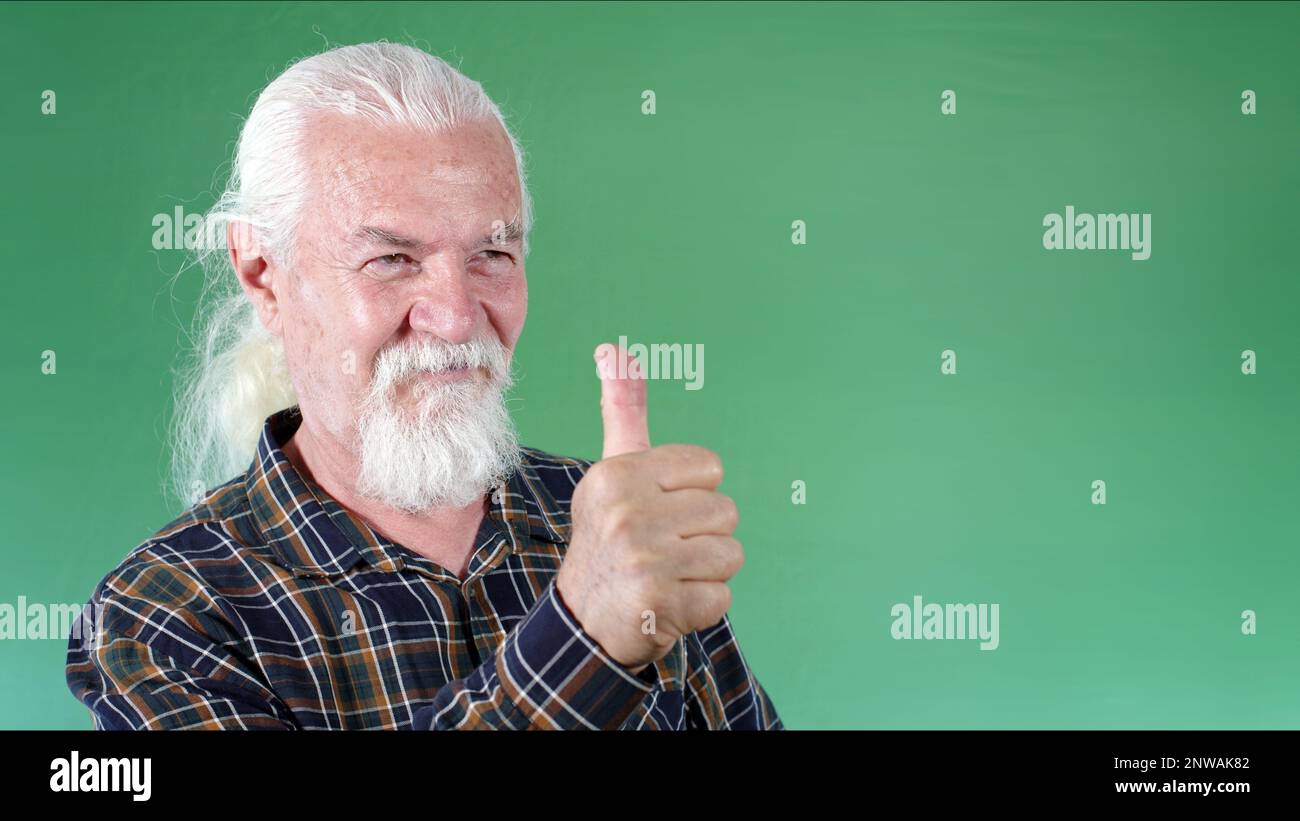 The Old man Approves Someone with His Finger and Smiles Stock Photo - Alamy