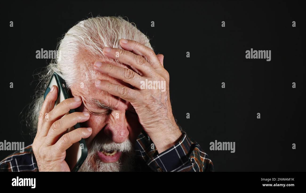The Old man gets very upset when bad news comes on the phone call Stock ...