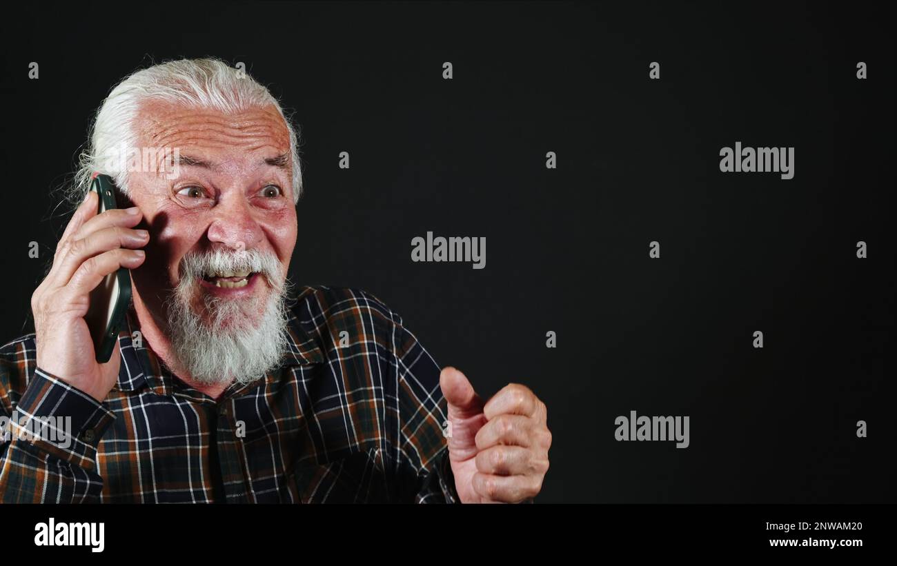 The Old Man Gets a Very Good News on the Phone Photo Stock Photo - Alamy