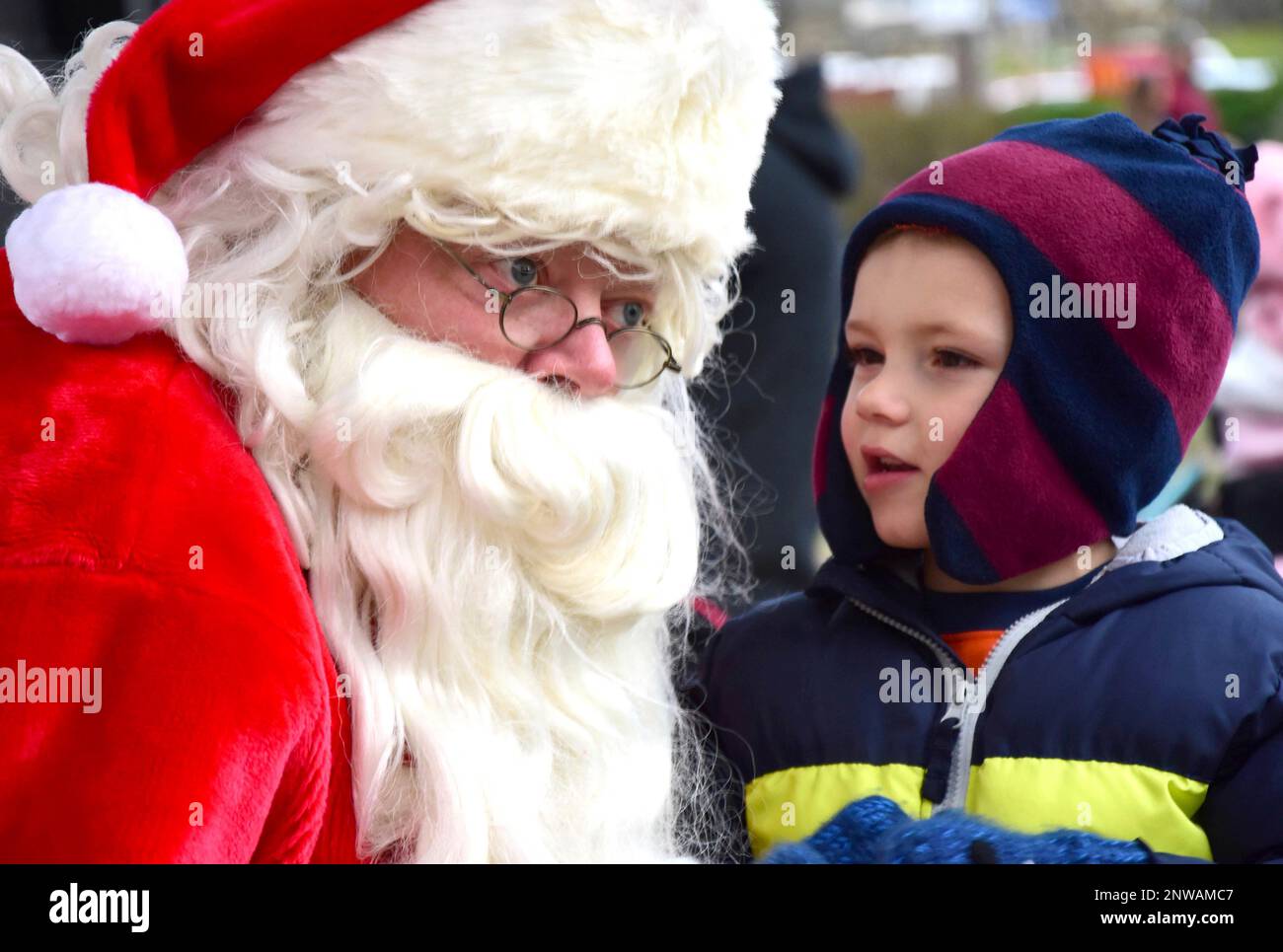 Santa Claus listens while Landen Sherman, 4, tells him what he wants ...