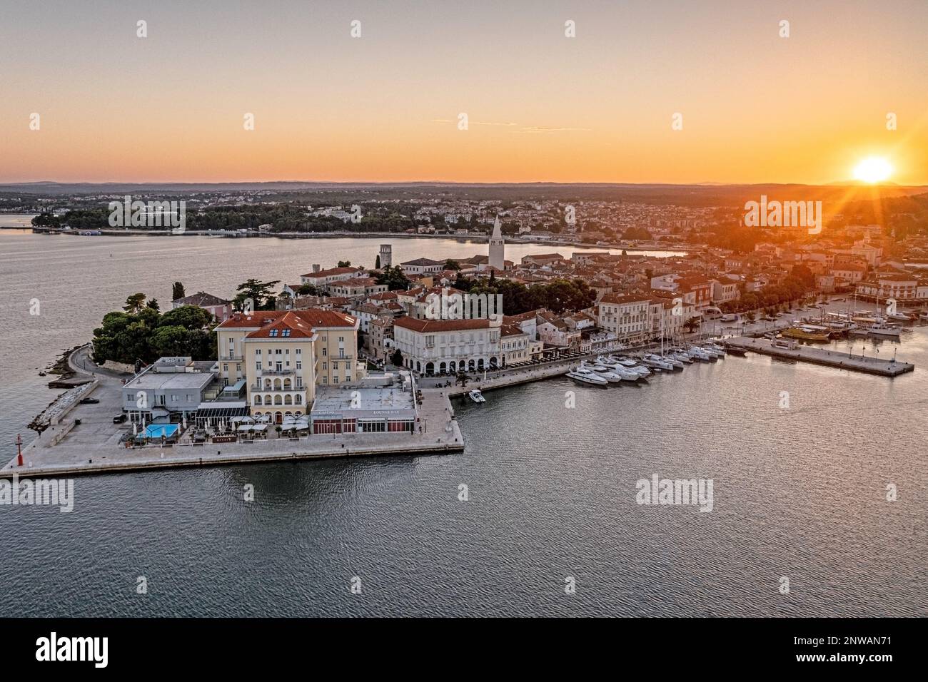 Drone panorama of Croatian coastal town Porec with harbor and promenade ...