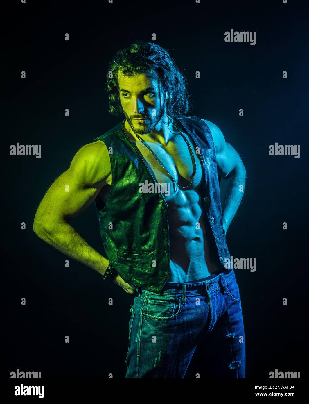 Confident, attractive young man with open vest on Stock Photo - Alamy