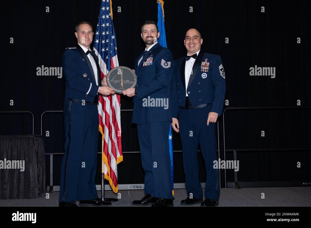 Tech Sgt. Luke Howell, center, 4th Operations Group section chief ...
