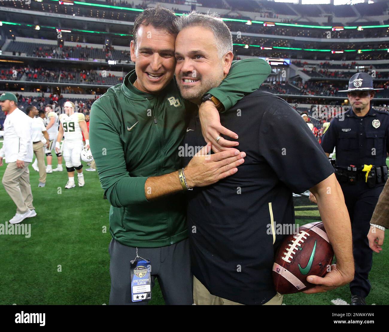 Baylor athletic director Mack Rhoades, left, congratulates head coach ...