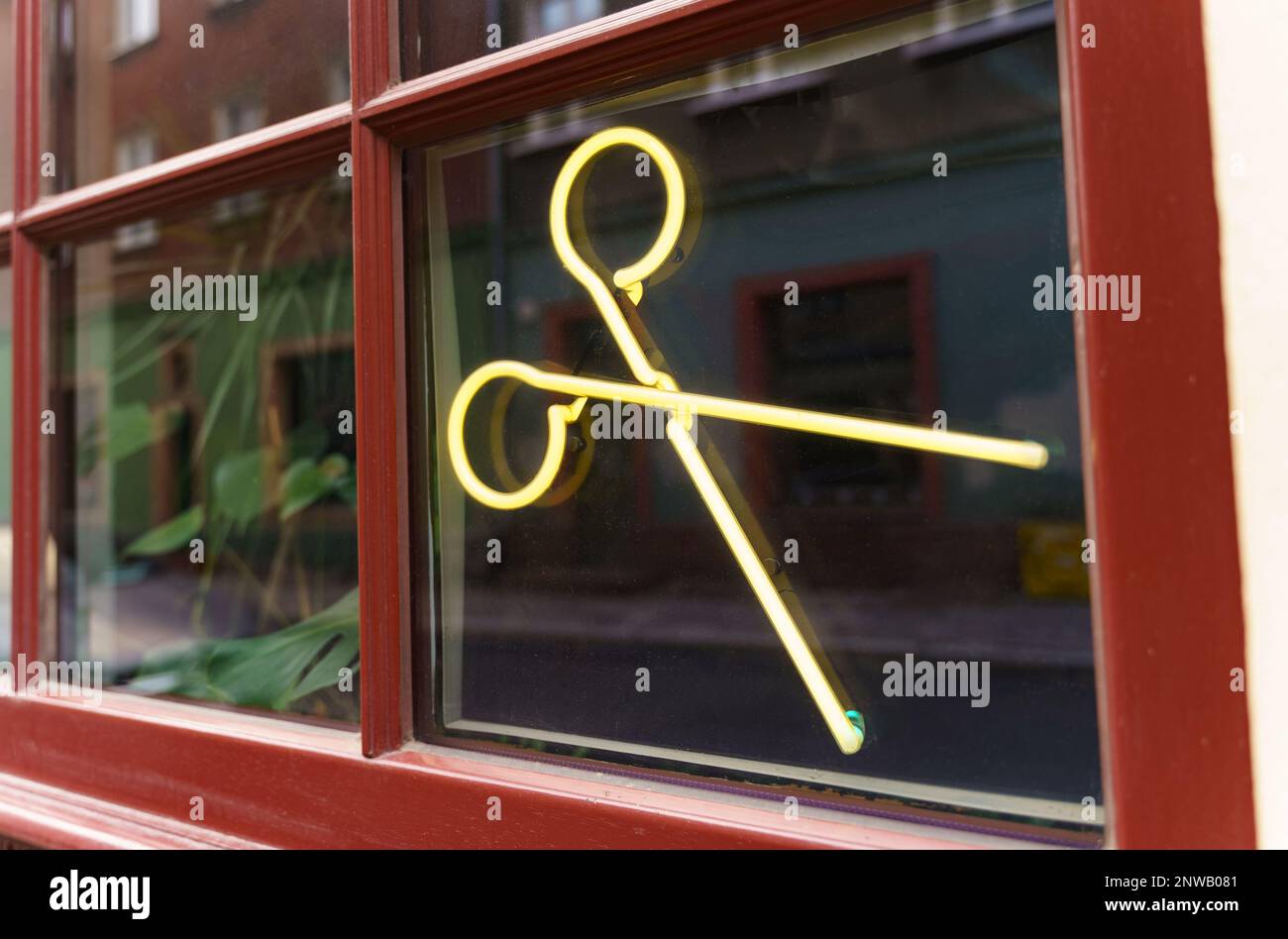 Vintage retro window with neon scissors in a barbershop Stock Photo - Alamy
