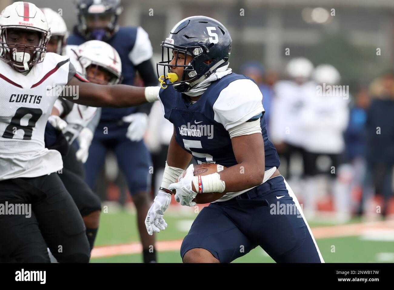 Midwood's Tyler Bartholomew #5 in action against Curtis during a high ...