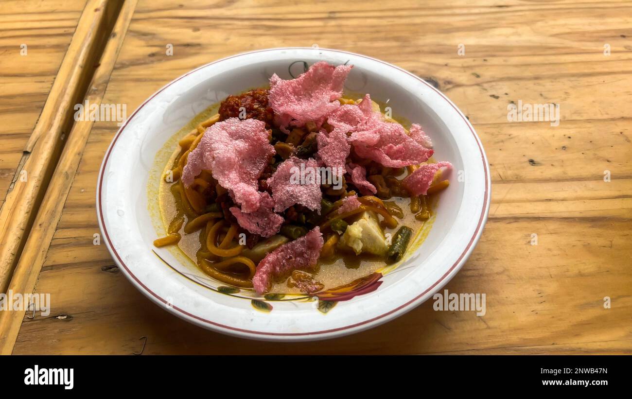 Lontong Sayur Medan. Rice cake soup with vegetable curry, egg with ...