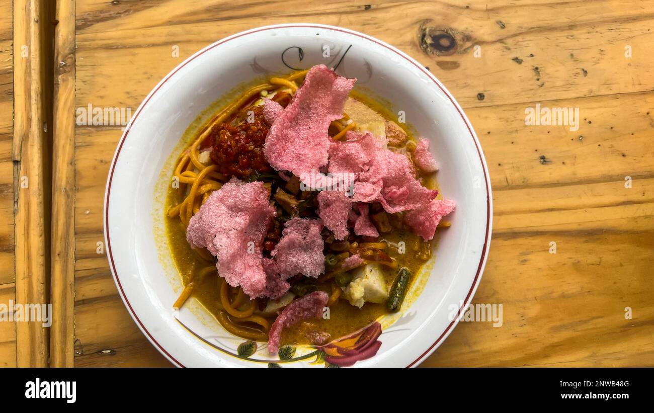 Lontong Sayur Medan. Rice cake soup with vegetable curry, egg with ...
