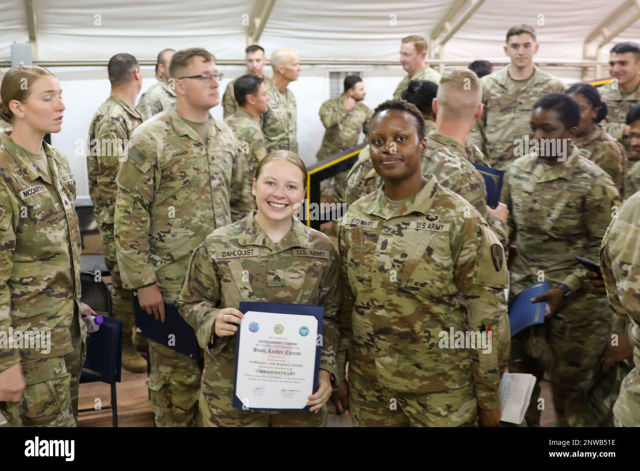 U.S. Army Sgt. Corrine Dahlquist poses for a photo beside Command Sgt ...