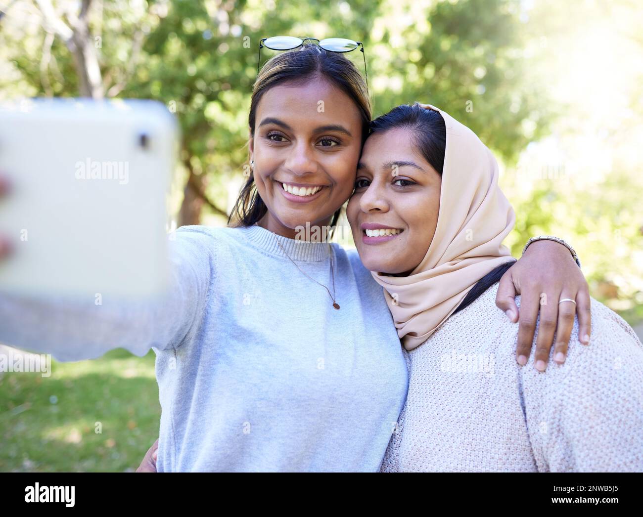 Girl, friends and islam for selfie in park with smile, hug and happy ...
