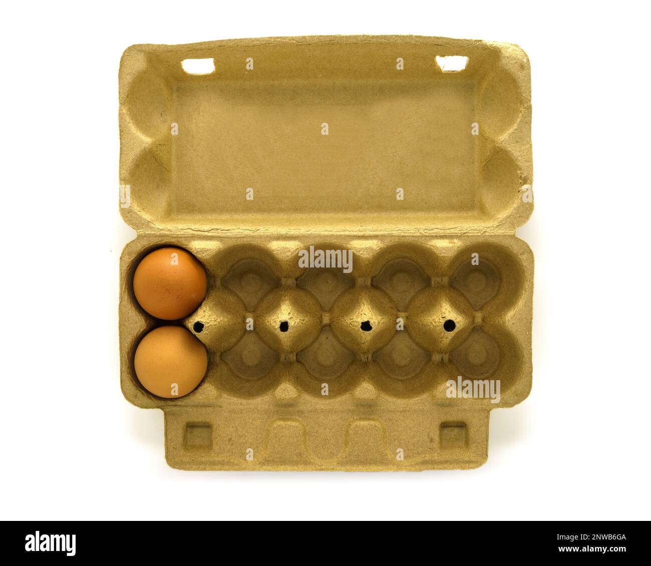 open yellow box of eggs with two brown eggs isolated on white ...