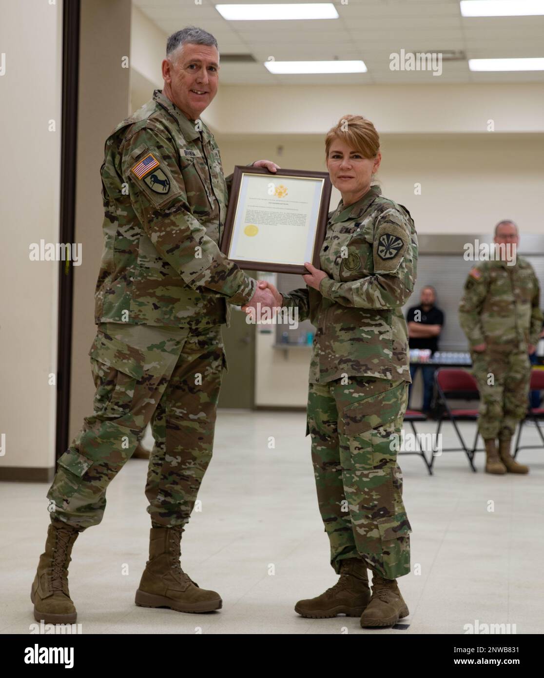 Brig. Gen. Lonnie Branum presents Lt. Col. Peggy Grunewald the ...