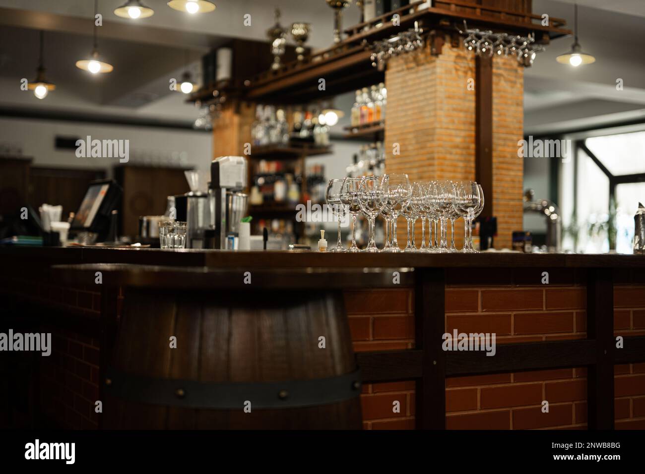 Empty bar with old barrel interior, wooden furniture and pub counter ...