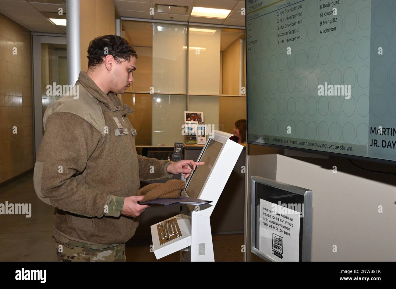 Customers check in on the DynaTouch Queue at the Military Personnel ...