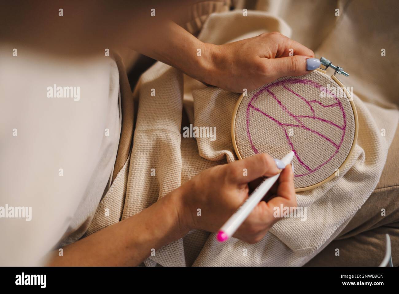 Woman sewing cross stitch hi-res stock photography and images - Alamy