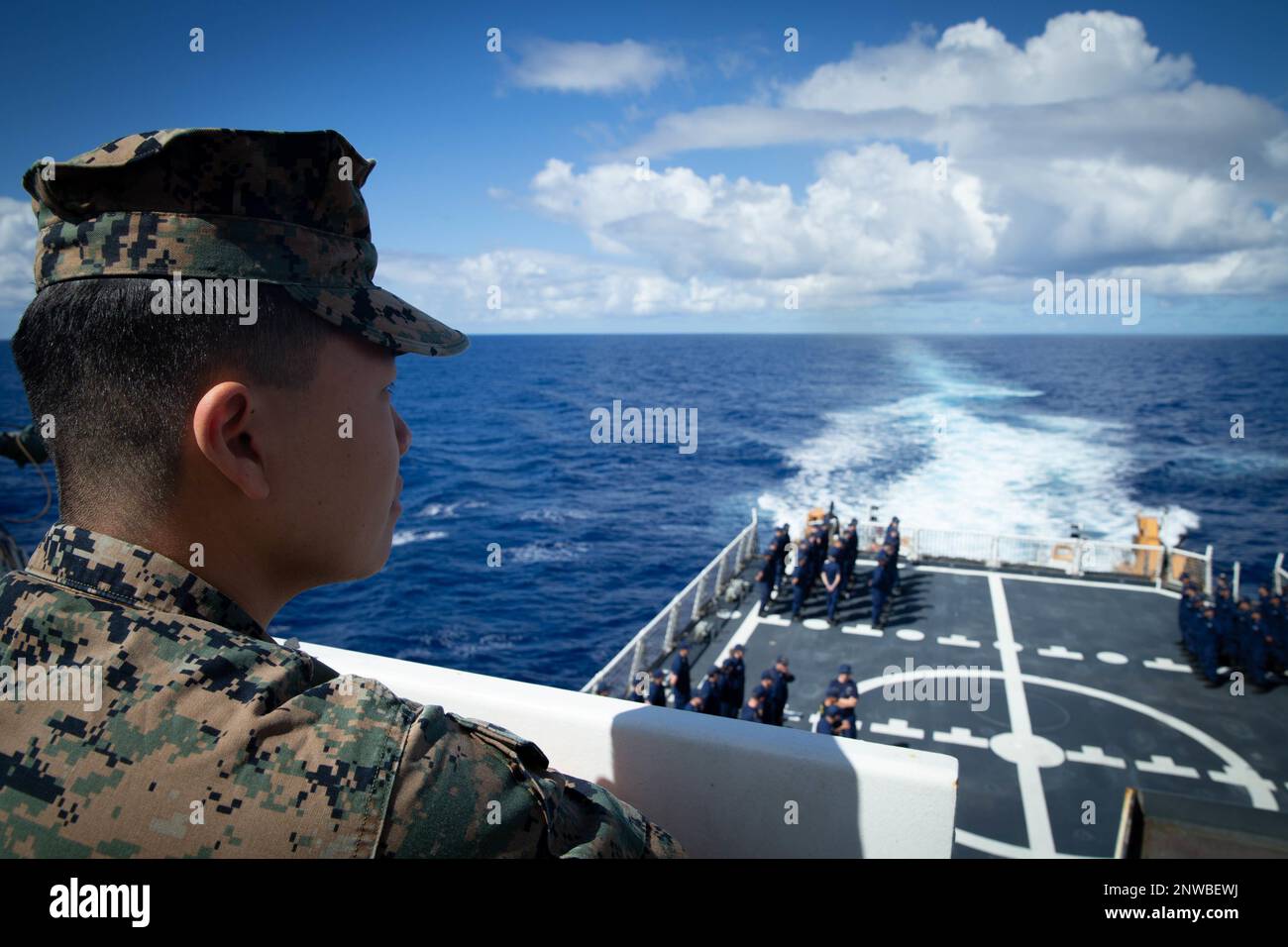 U.S. Marine Corps Sgt. Junjie Kuang, a linguist assigned to USCGC Stone ...