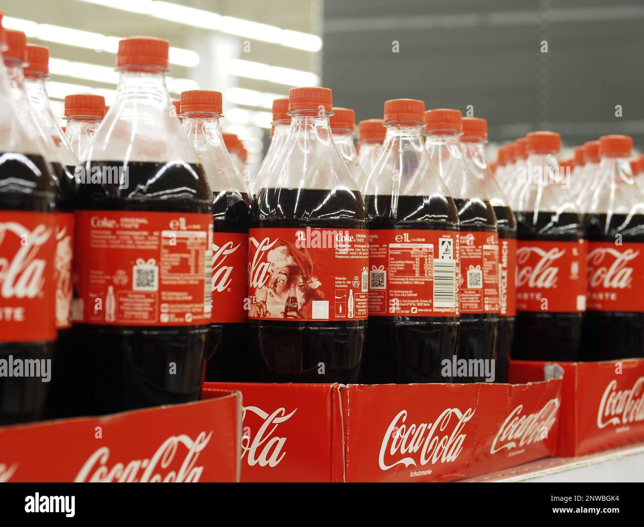 In this photo illustration, Row of coca-cola bottles in the store Stock ...