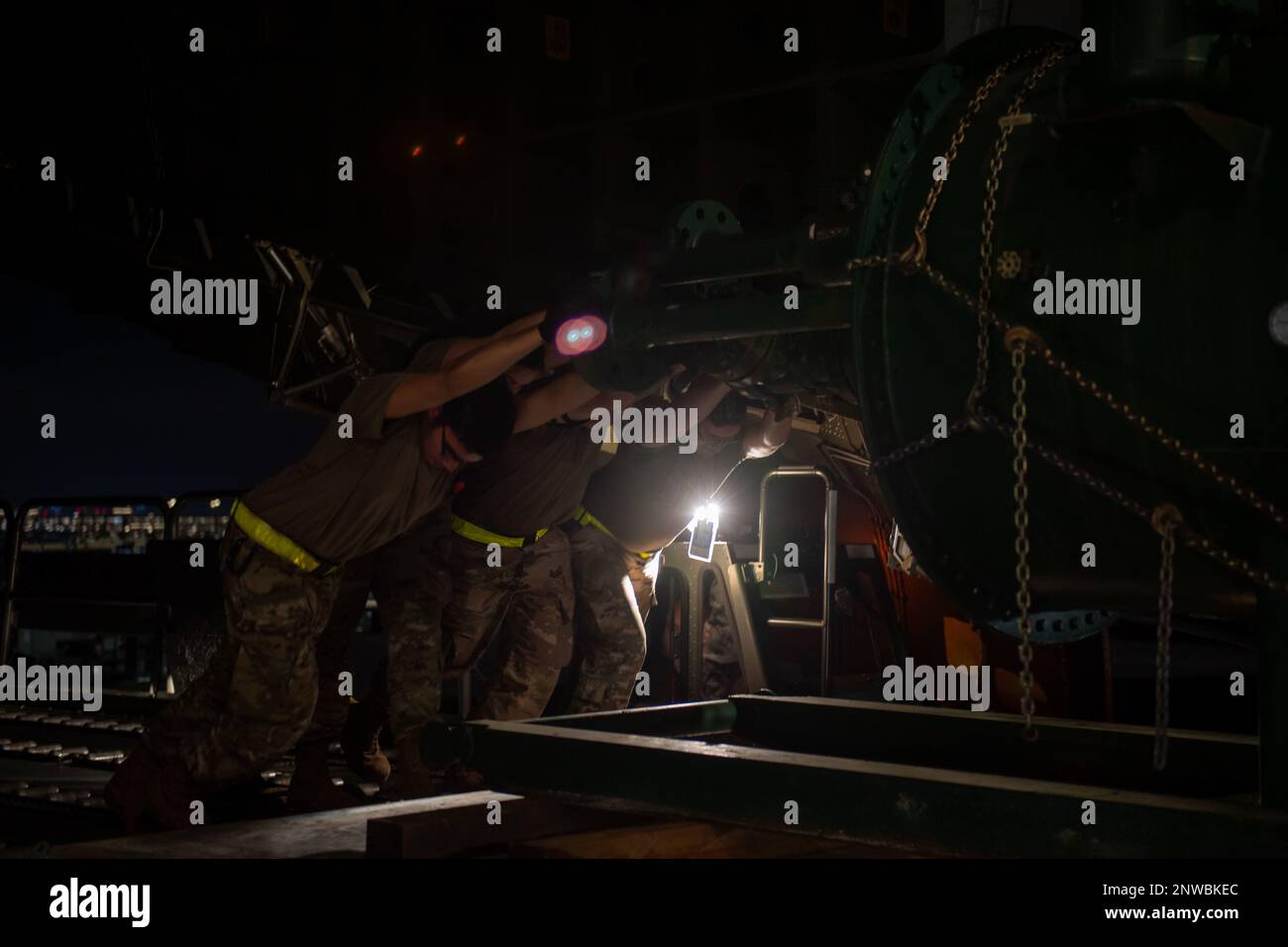 U.S. Airmen assigned to the 437th Aerial Port Squadron, push U.S ...