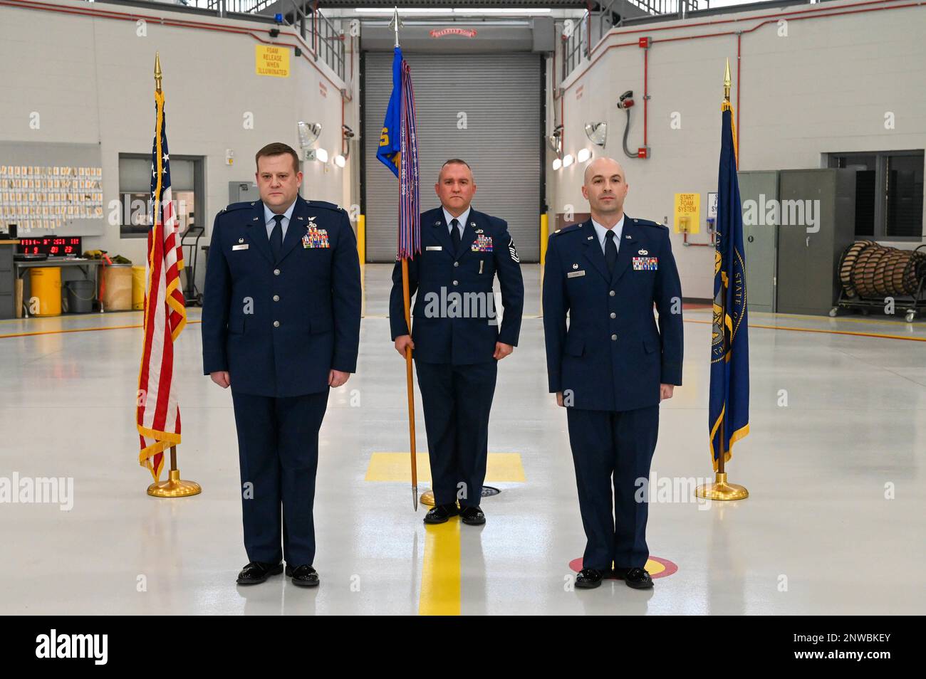 Col. John Loken, 155th Maintenance Group commander stands at attention ...