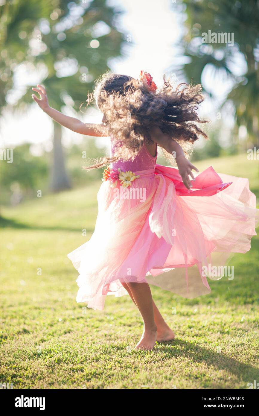 Little back girl in pink tutu dress dancing Stock Photo - Alamy