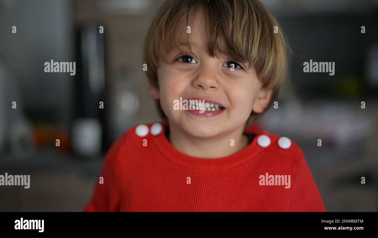 Portrait of a happy little boy closeup face smiling at camera ...