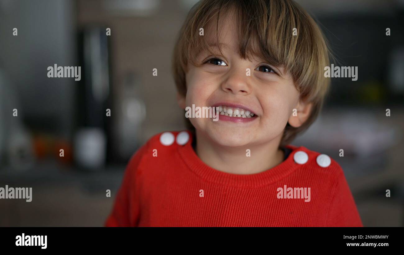 Portrait of a happy little boy closeup face smiling at camera ...