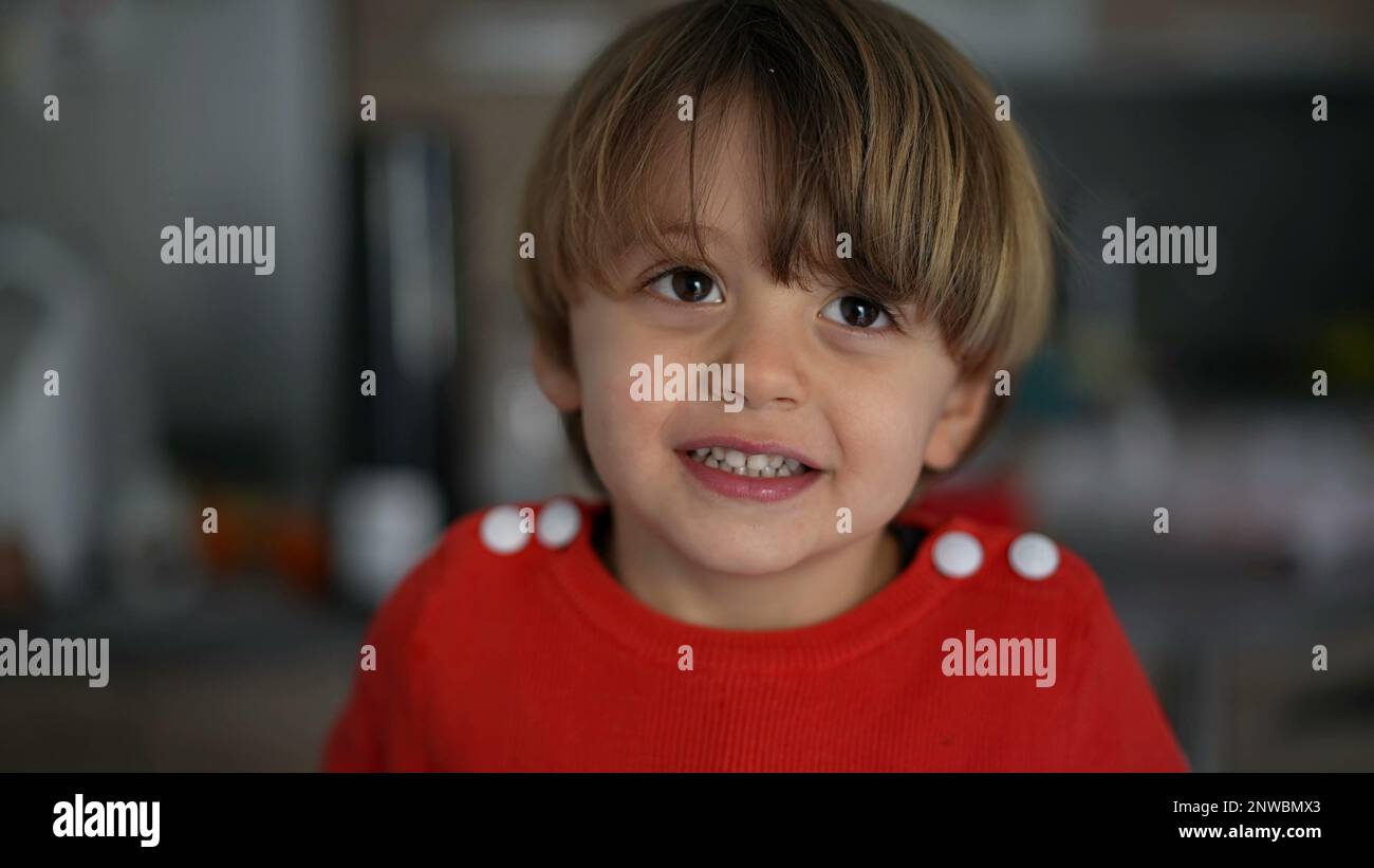 Portrait of a happy little boy closeup face smiling at camera ...