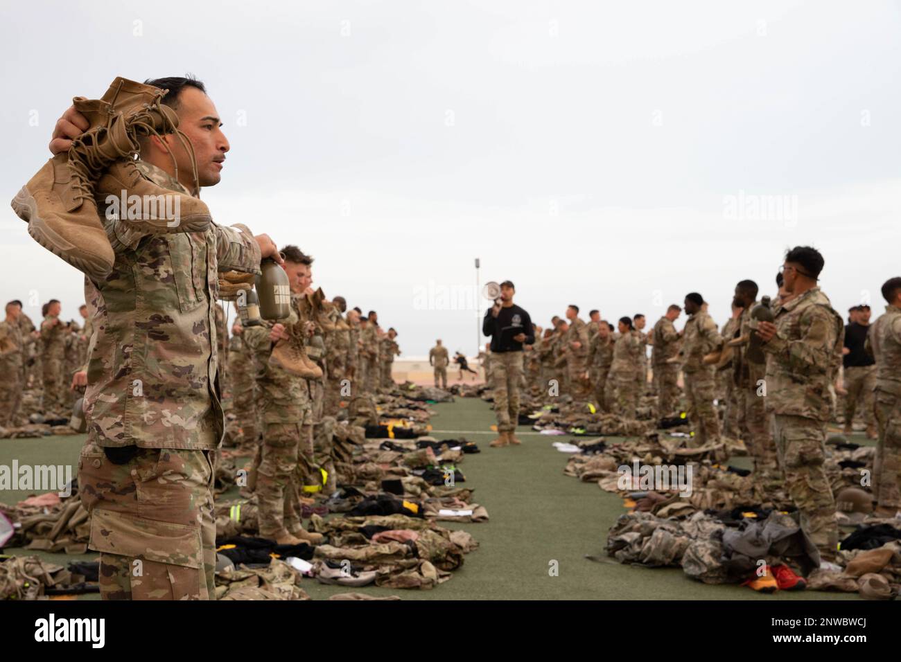 Soldiers hold their boots and canteens for an inspection during Air ...