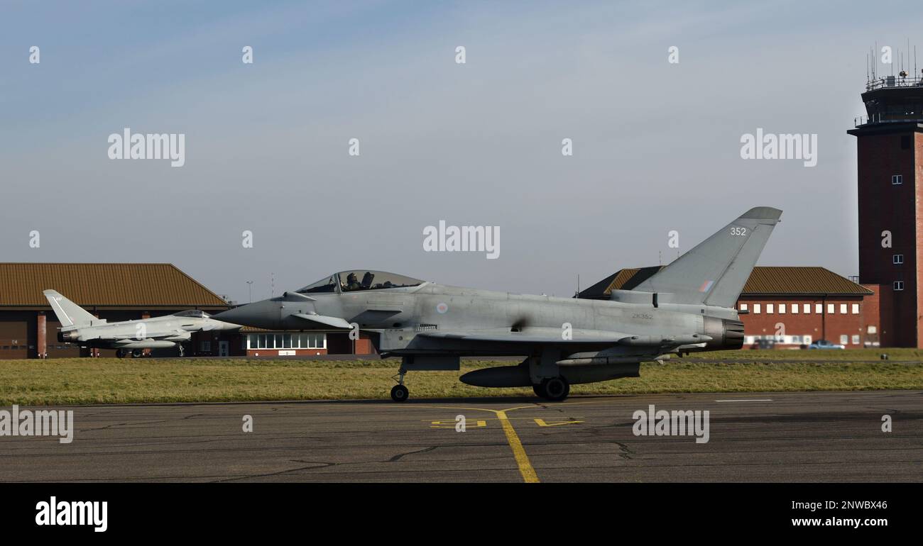 Eurofighter Typhoons taxi from a hardstand as they prepare to take off ...