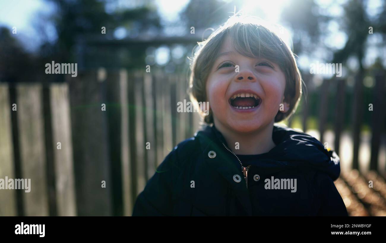 One little boy authentic real life laugh and smile. Happy child face ...