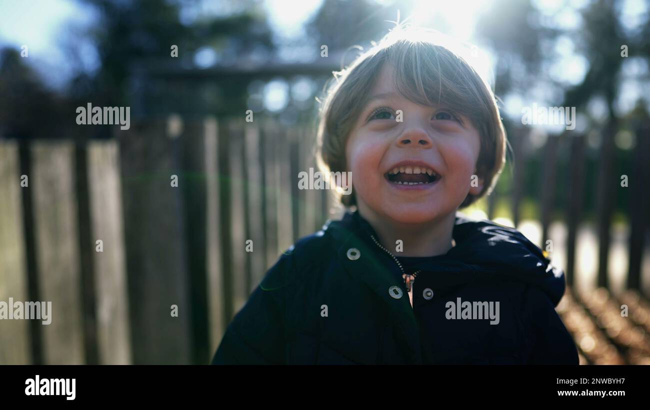 One little boy authentic real life laugh and smile. Happy child face ...