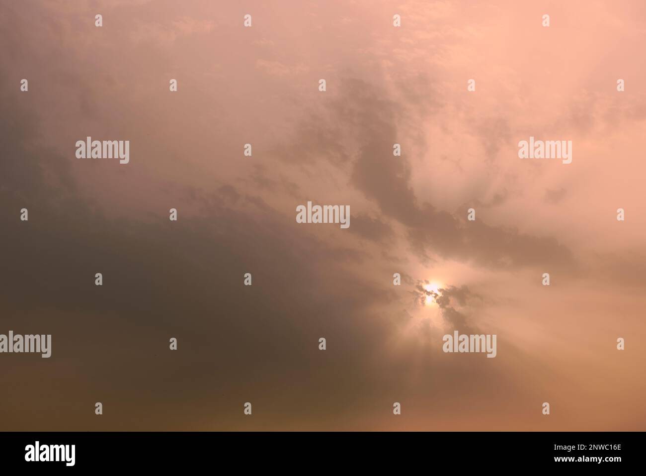 Sky, with diffused sun clouds colourful Stock Photo - Alamy