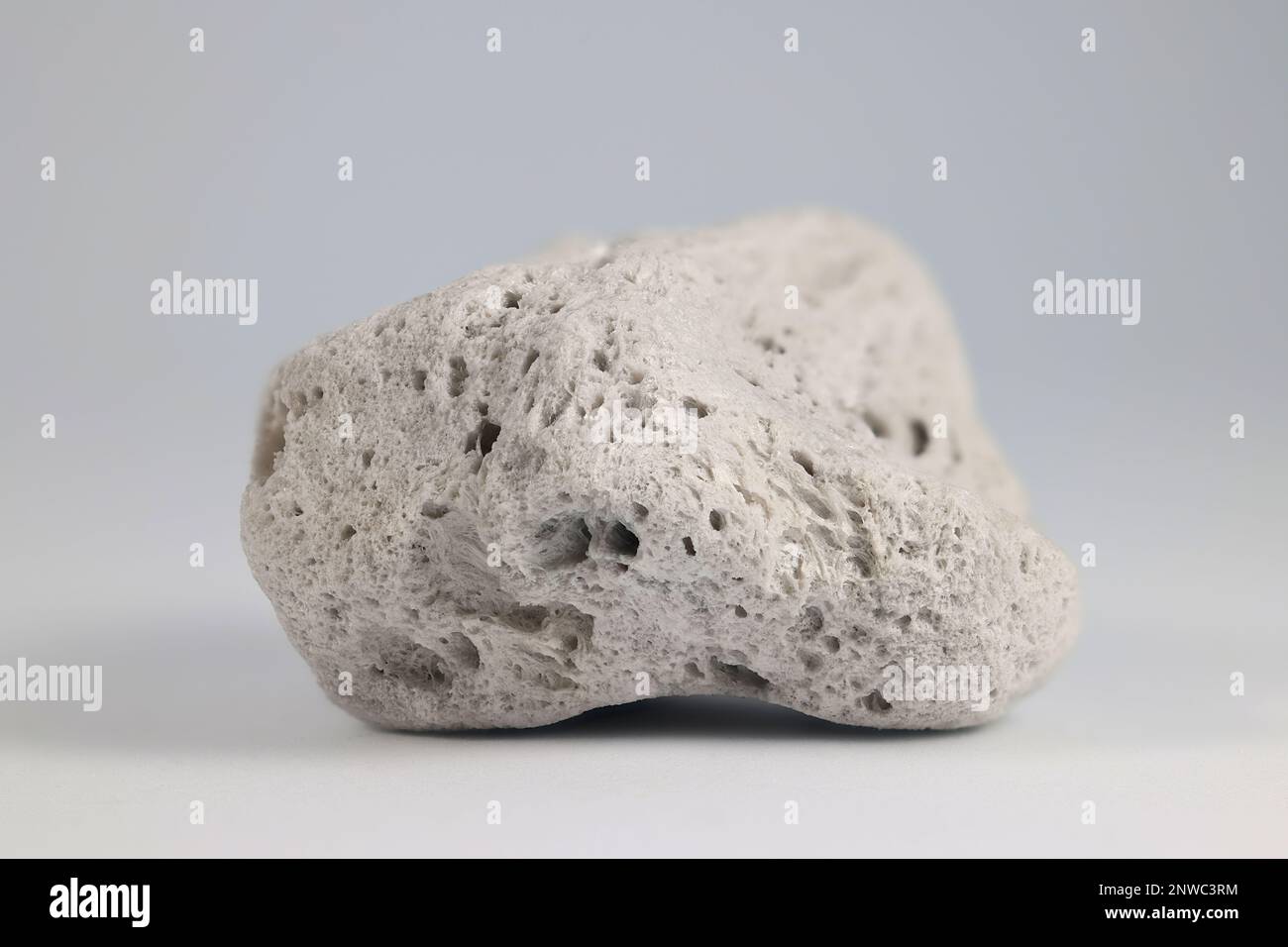 Pumice is a volcanic rock that consists of highly vesicular rough ...