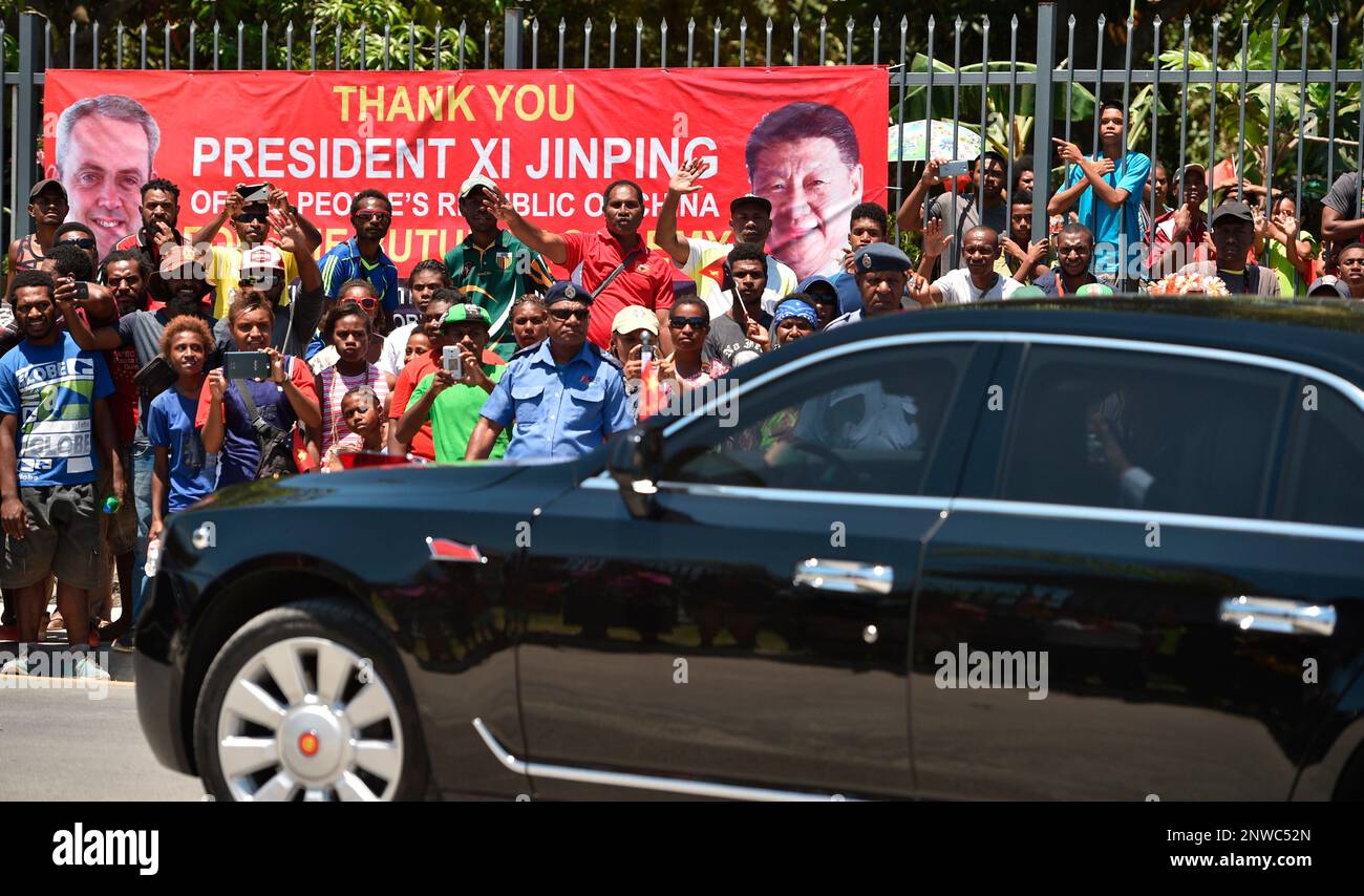 Locals wave as Chinese President Xi Jinping's motorcade leaves the ...