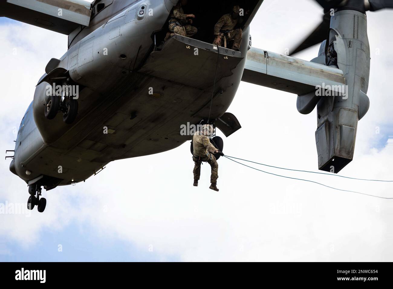 A U.S. Marine with Marines Forces Special Operations Command rappels ...