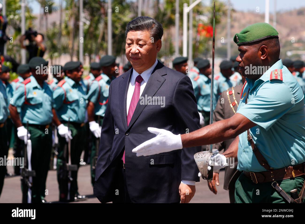 China's President Xi Jinping is shown the way during a welcome ceremony ...