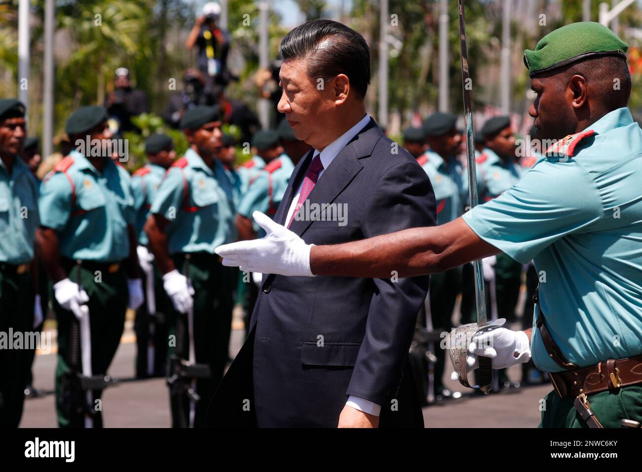China's President Xi Jinping is shown the way during a welcome ceremony ...