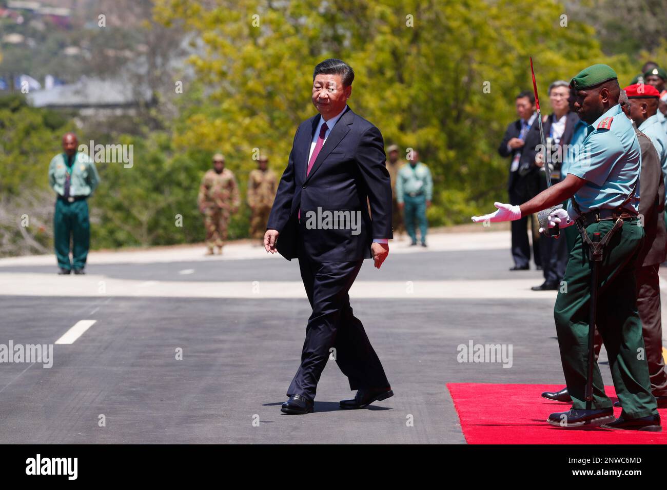 China's President Xi Jinping is shown the way during a welcome ceremony ...