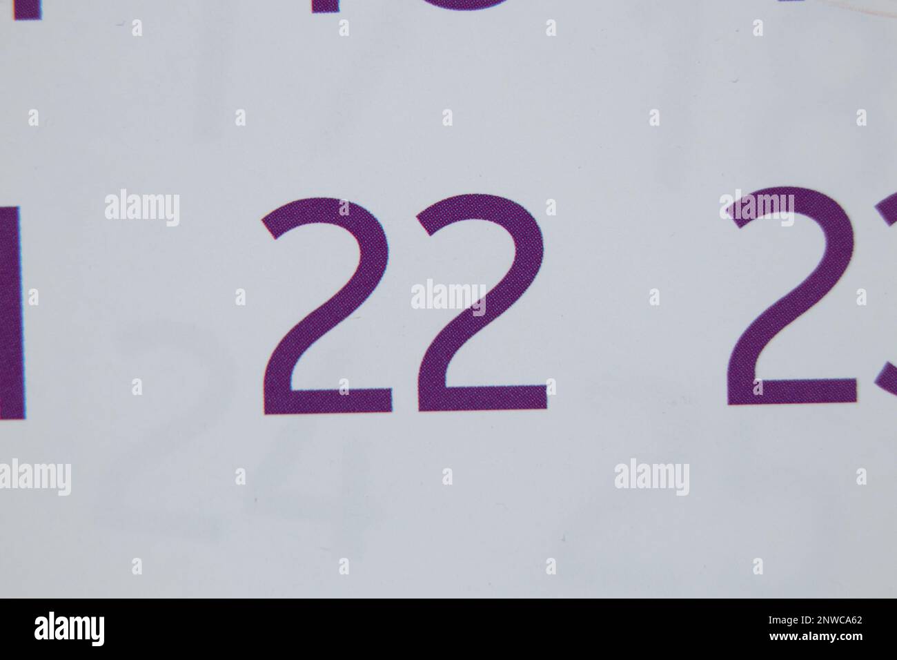 22 on white paper as background, calendar macro photo Stock Photo - Alamy