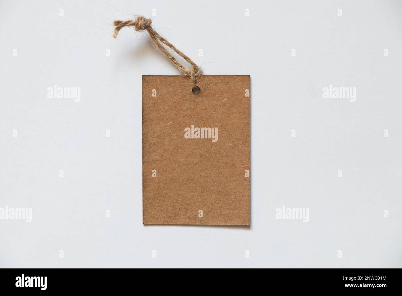 brown paper blank price tag on rope on isolated background, price tag ...