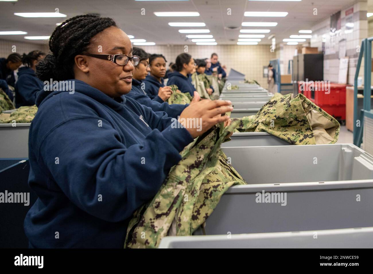 U.S. Navy recruits receive uniforms at Recruit Training Command, Great ...