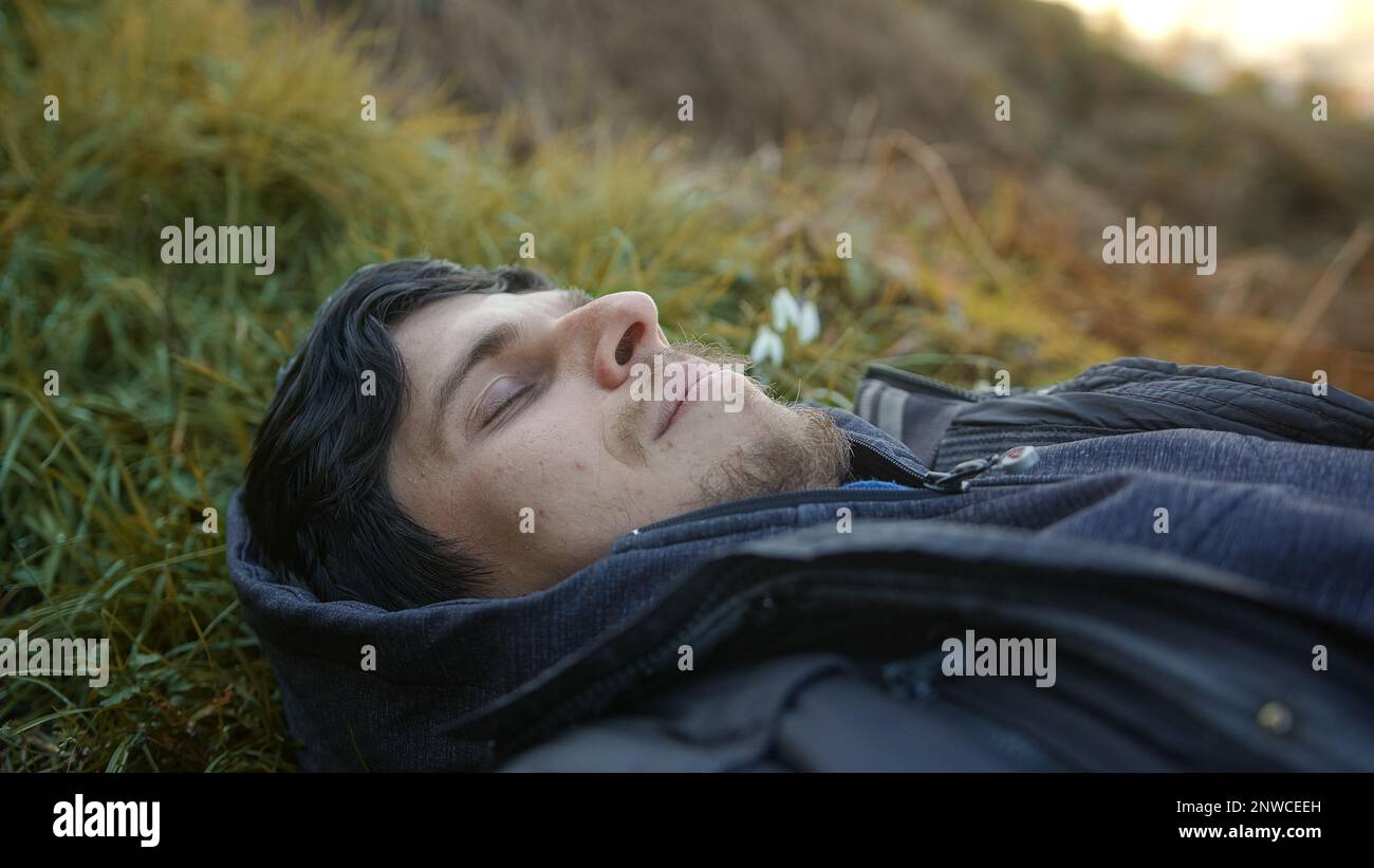 Relaxing in the Heart of Nature: Handsome Young Man Taking a Deep ...