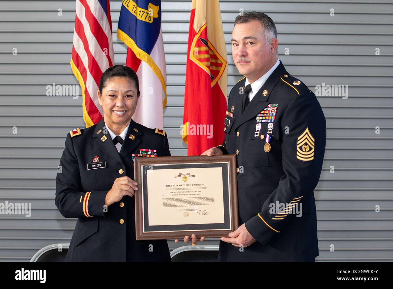 Command Sgt. Maj. Randy Ly, right, completes his last official duty for ...