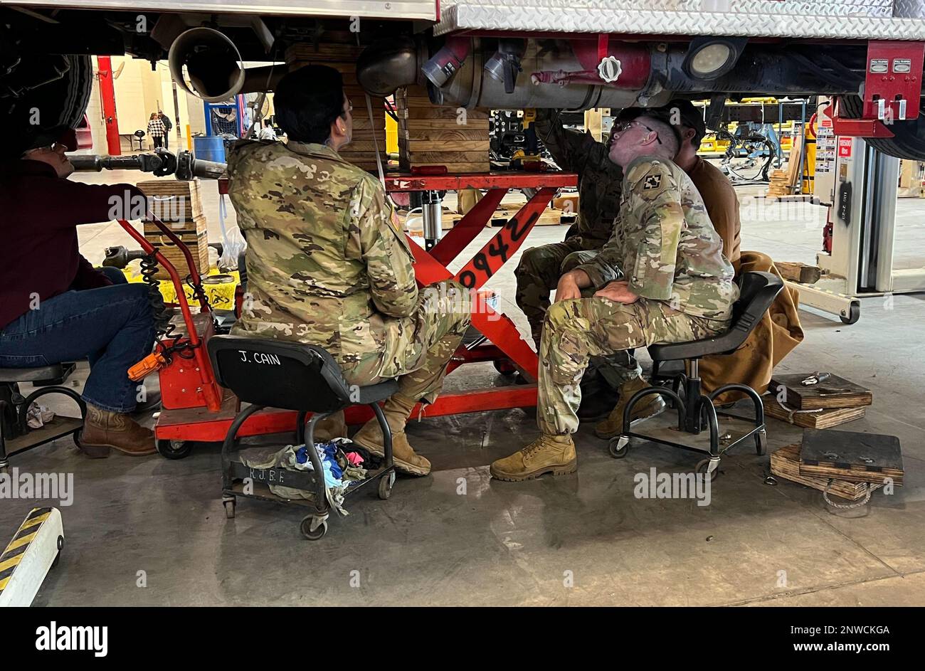 Soldiers from various installations work under a fire truck at Red ...