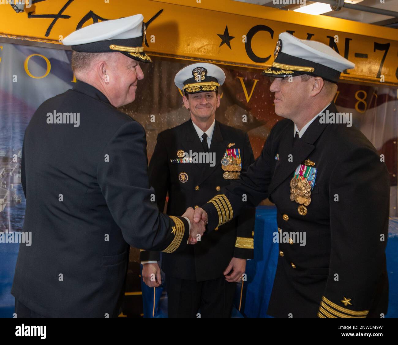 Capt. Stefan Walch (left), shakes hands with Capt. Mac Harkin ...