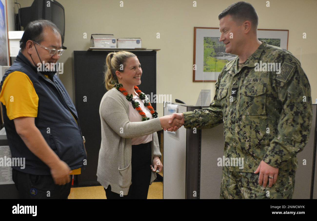 TAMC DCO Navy Capt. Ian Fowler presented Ms. Andrea Stephens a DCO coin ...